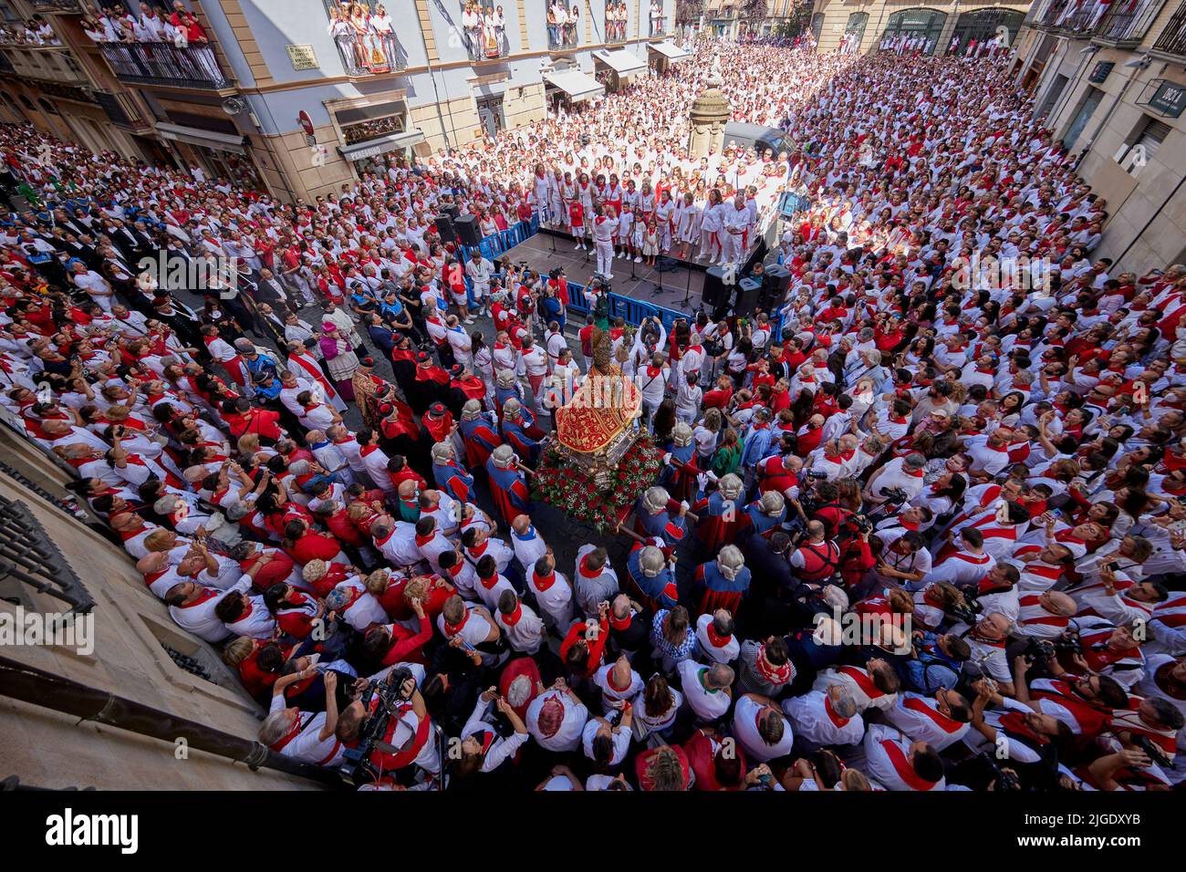 People attend the San Fermin procession during the traditional San ...