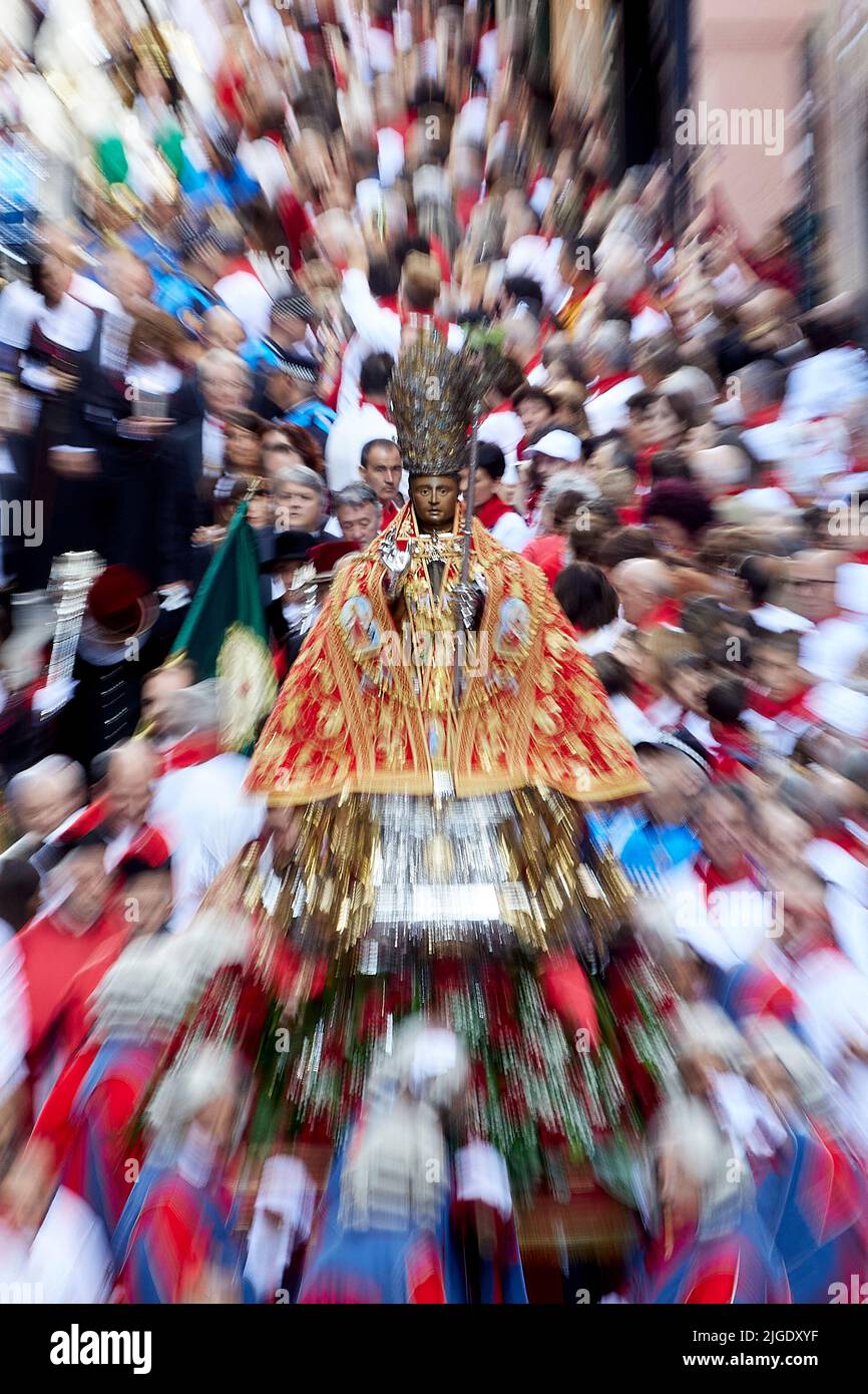 People attend the San Fermin procession during the traditional San ...
