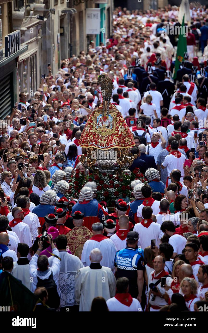 People attend the San Fermin procession during the traditional San ...