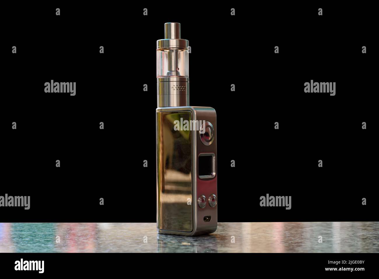 A closeup of an electronic cigarette on a table isolated on a black ...