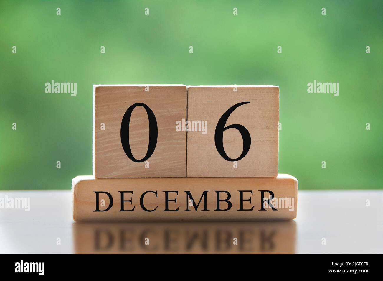 December 6 text on wooden blocks with blurred nature background. Copy ...