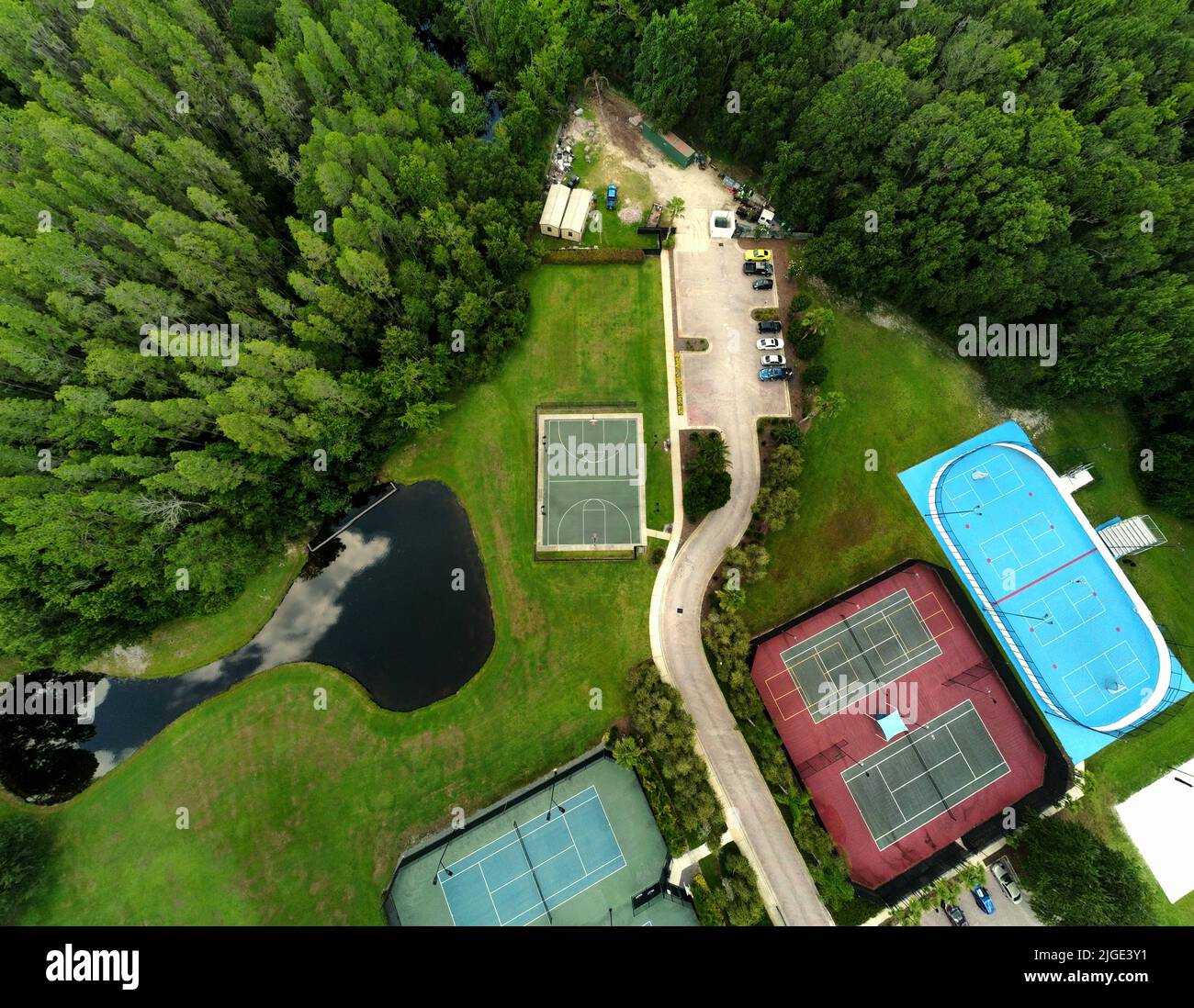 An aerial top view of professional courts of tennis and basketball ...