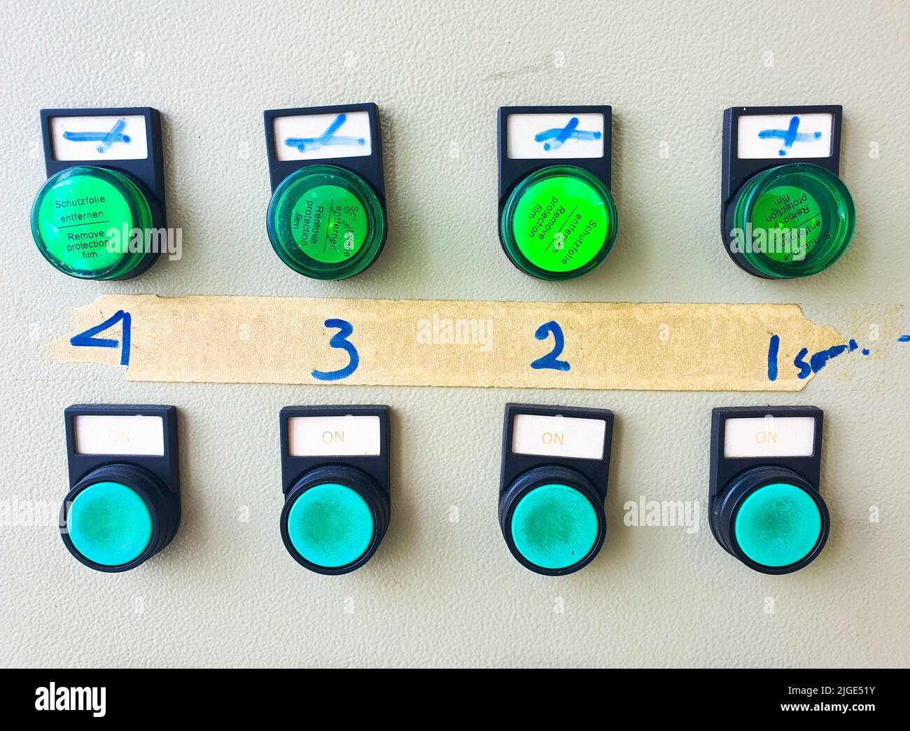 Control panel for operation of machine in industrial. Green button with ...