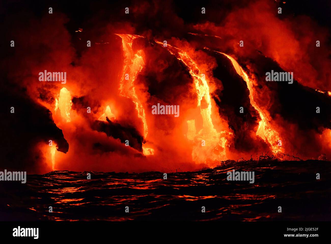Lava pouring into the ocean on Hawaii Big island Stock Photo - Alamy