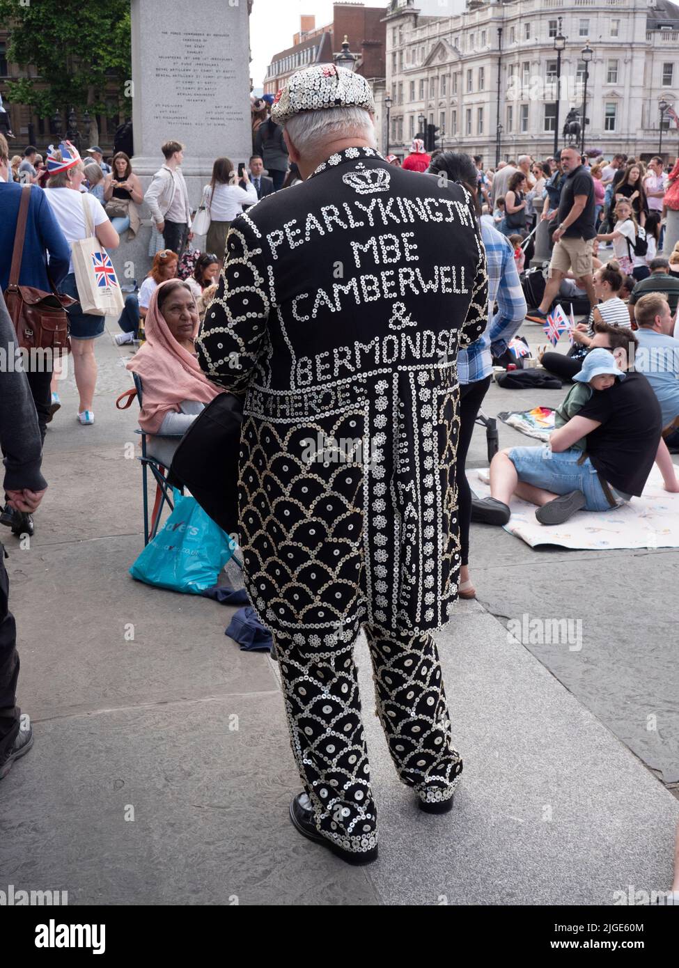 Jimmy Jukes, the Pearly King of Camberwell and Bermondsey, checking ...