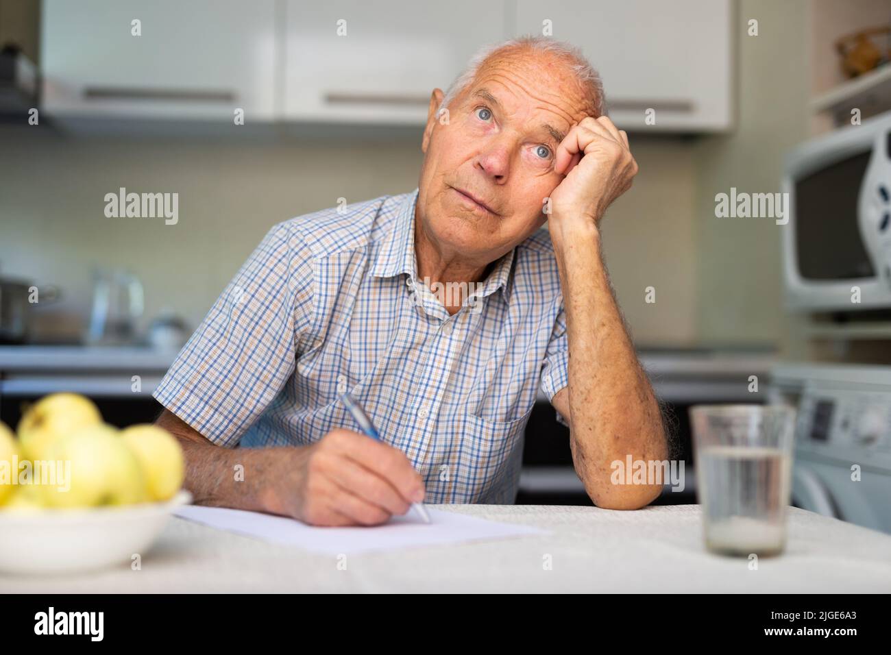 Old man writing letter hi-res stock photography and images - Alamy