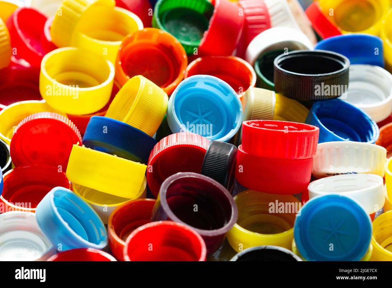 Caps from plastic bottles. Lots of colorful plastic bottle caps ...