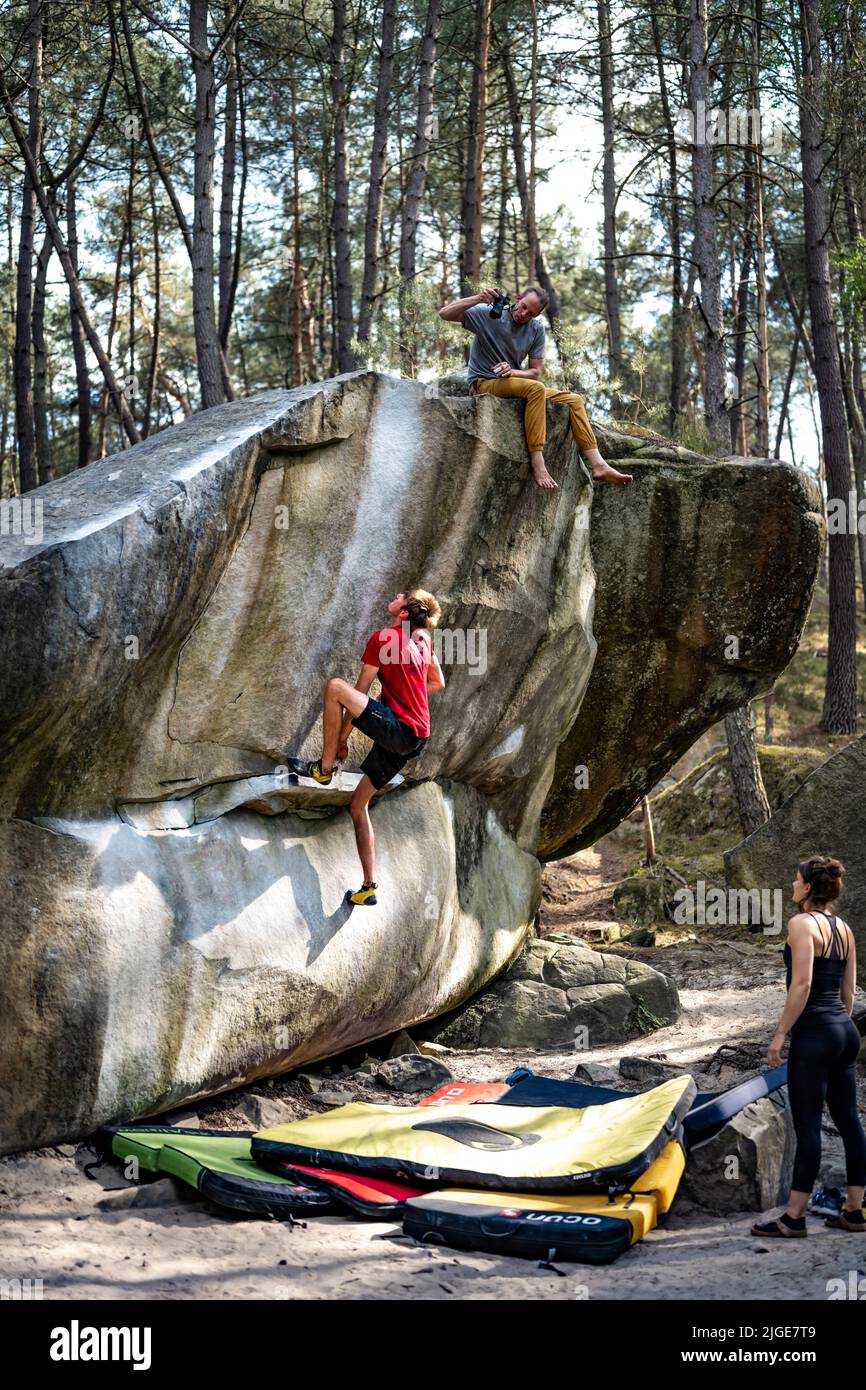 Athletic young man is jumping for top hold in famous and hard dyno ...