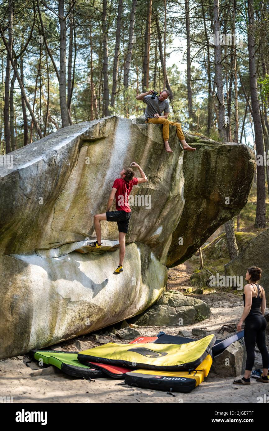 Athletic young man is jumping for top hold in famous and hard dyno ...