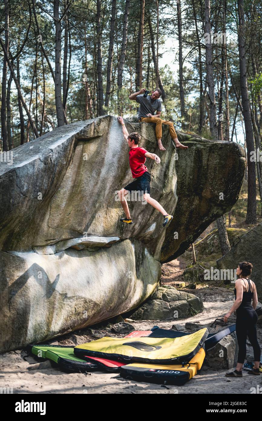 Athletic young man is jumping for top hold in famous and hard dyno ...