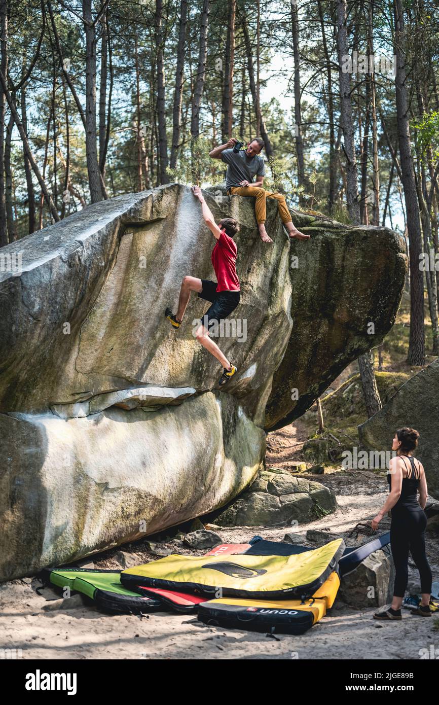 Athletic young man is jumping for top hold in famous and hard dyno ...