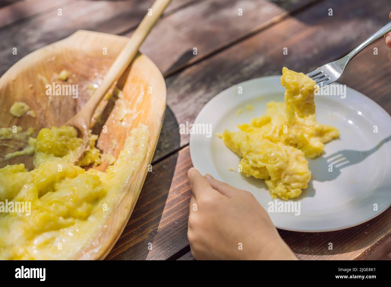Traditional Montenegrin Meal. Kacamak in wooden bowl in the outdoor ...