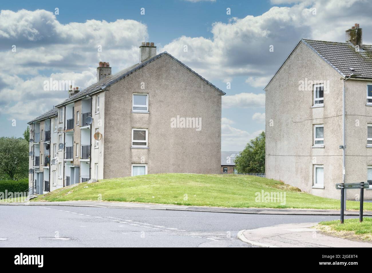 Derelict council house in poor housing estate slum with many social ...