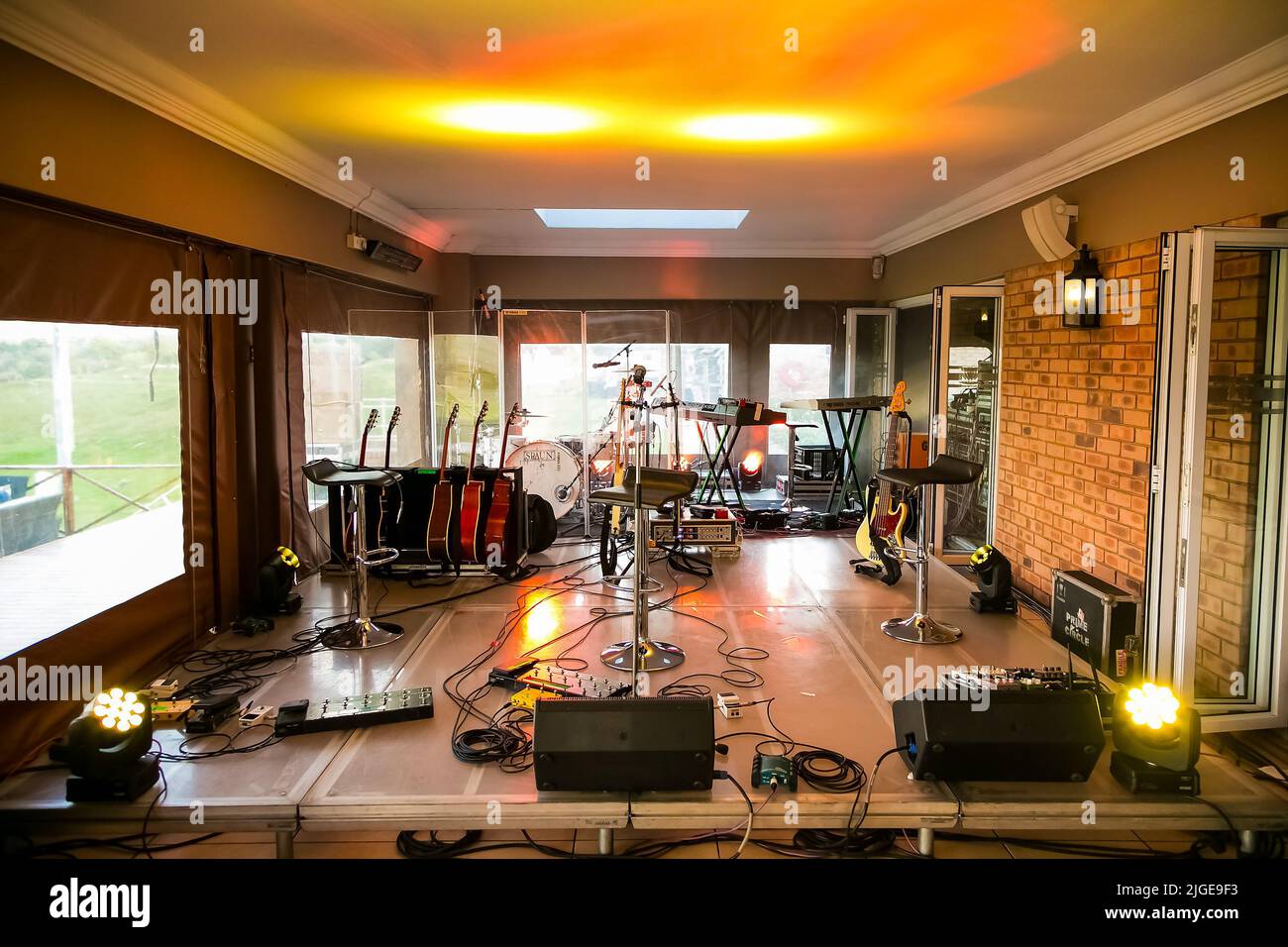 A small stage set-up for gig with musical instruments Stock Photo - Alamy
