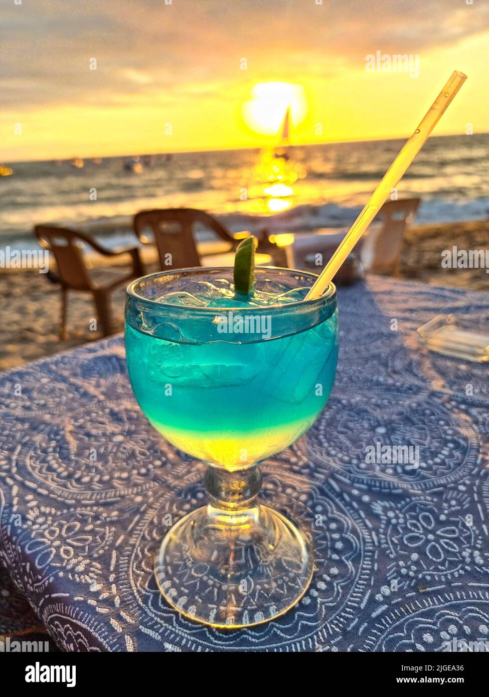 Drink of curazao cocktail in the edge of a Mexican beach Stock Photo ...