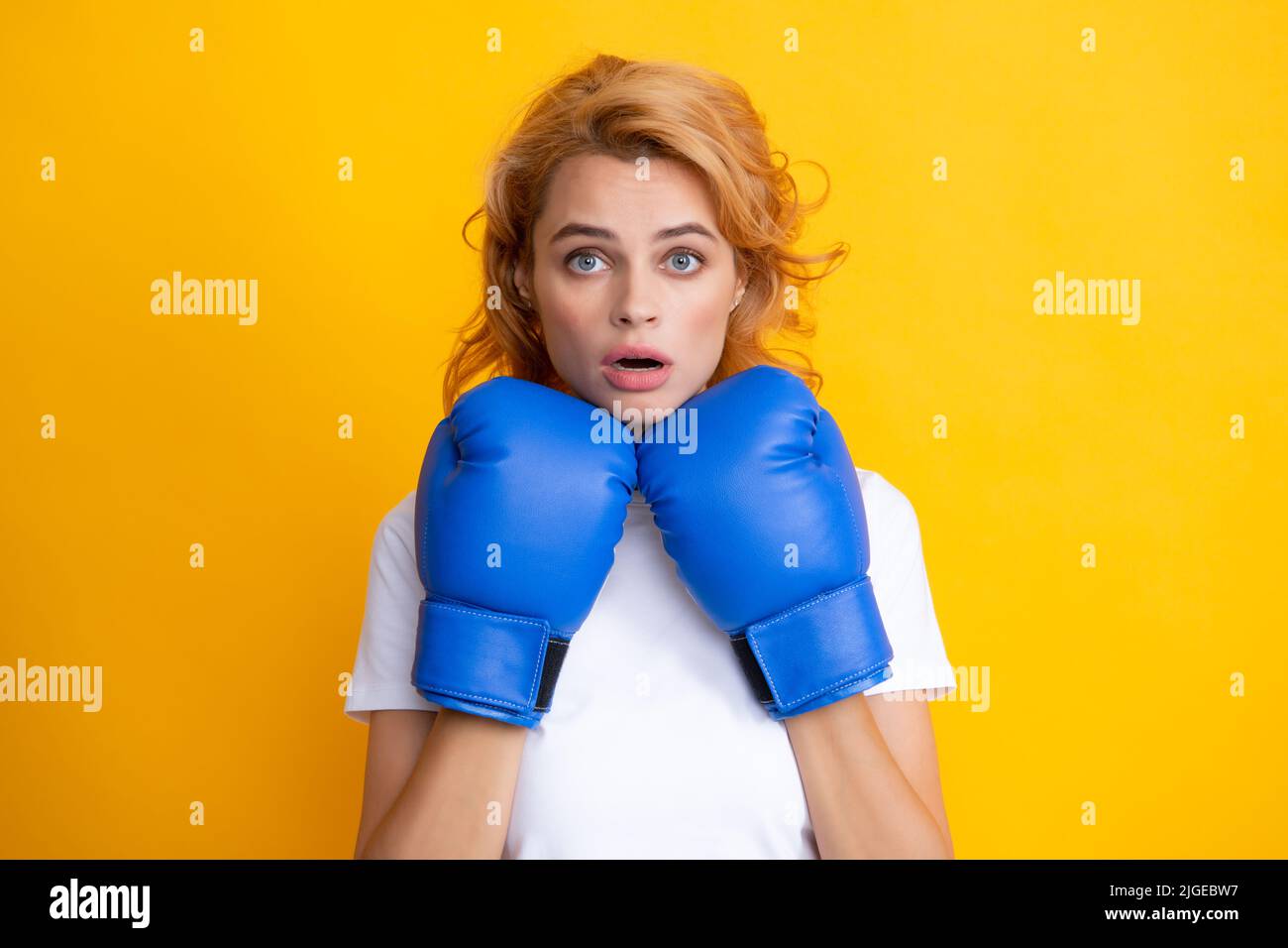 Woman in boxing gloves. Surprised female boxer Stock Photo - Alamy