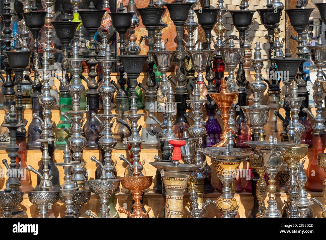 Hookahs of large and small sizes are made of glass on the market in ...