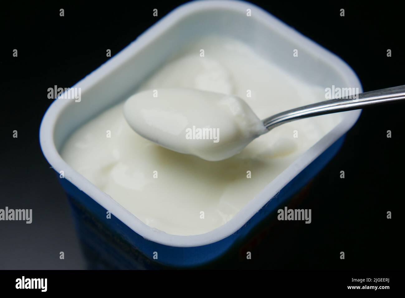 fresh yogurt in a bowl on table Stock Photo - Alamy