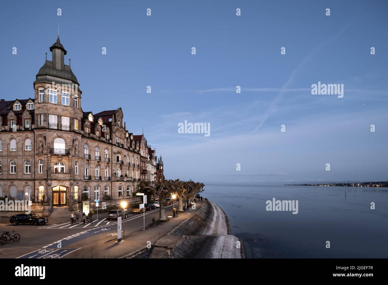 Magnificent houses are illuminated by lanterns on the promenade in the ...