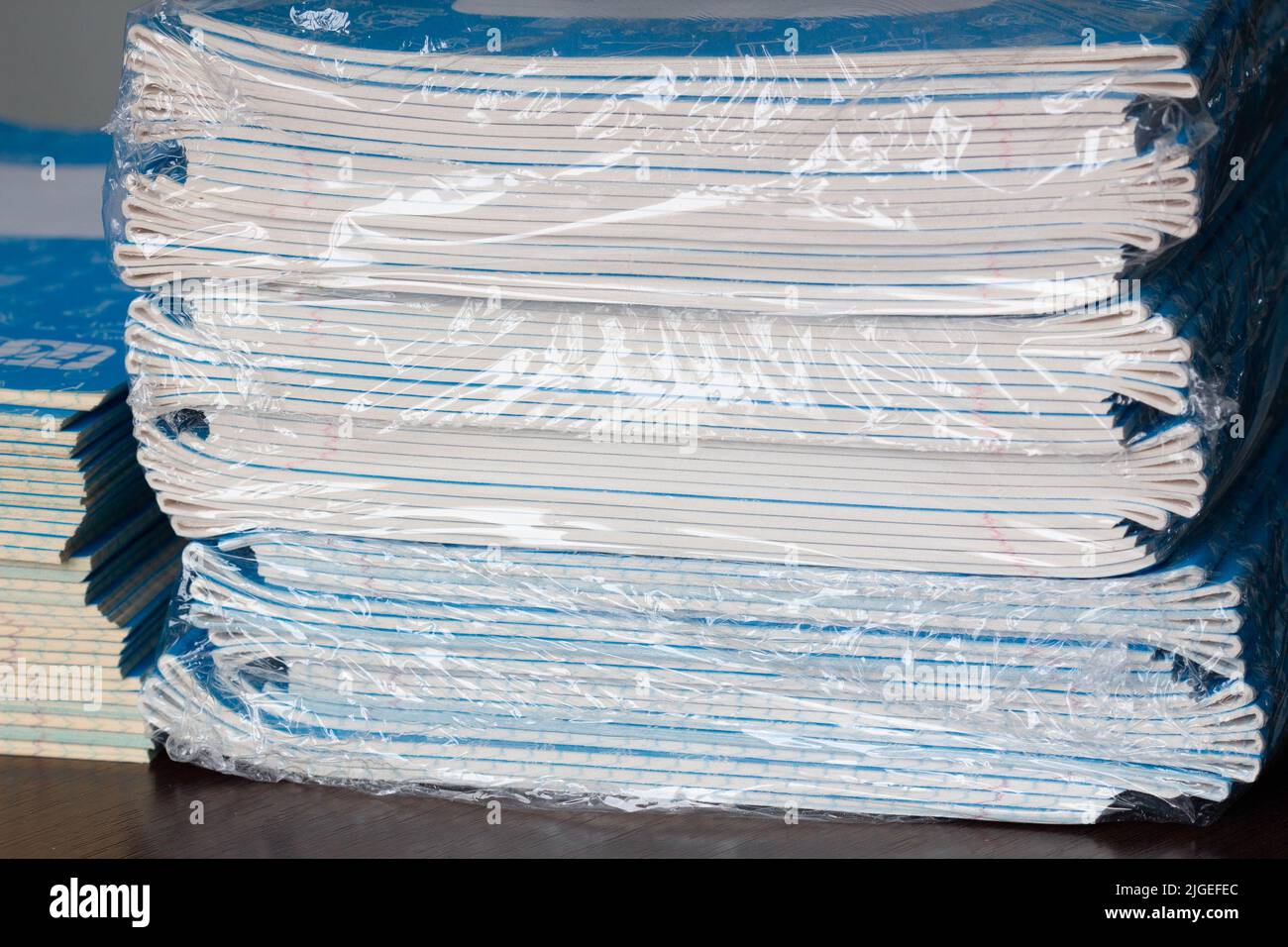 Stack of Notebooks. Back to school. A pack of blue school notebooks on ...