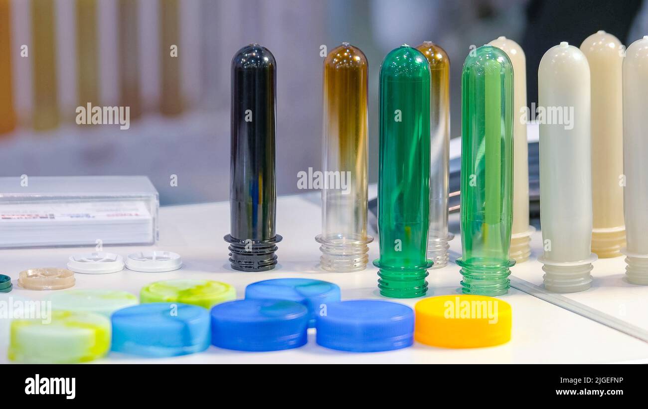 Collection of various colorful test tubes and caps. Glassware for ...