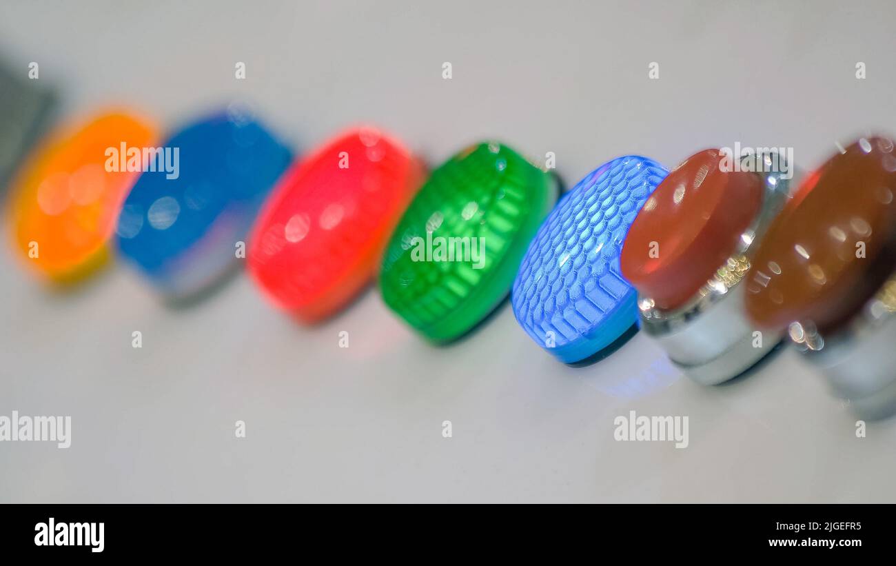 Close-up panel of colored led diode lights. Round brown buttons Stock ...