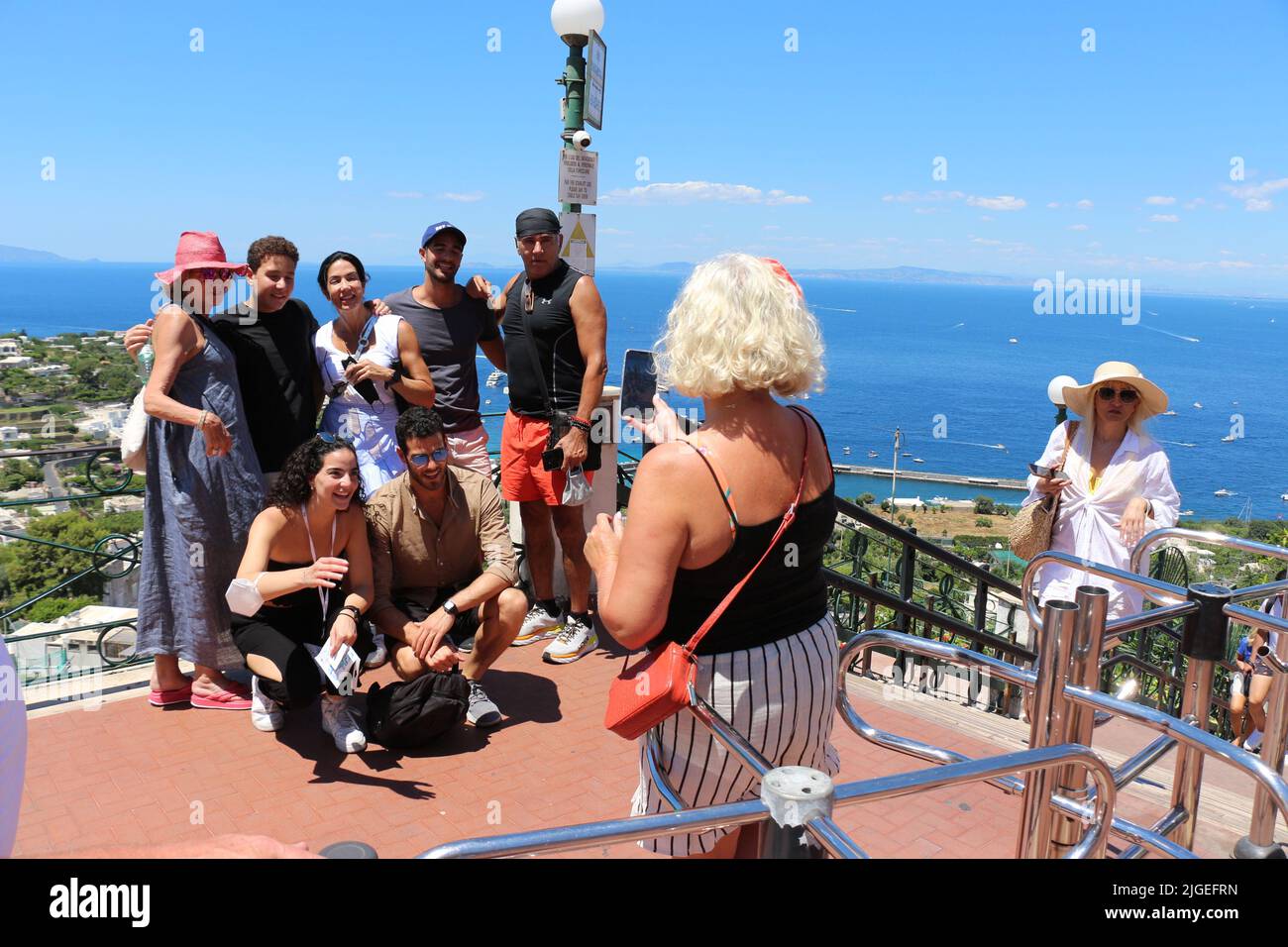Summer in Capri island (Italy): tourists stroll in famous Piazzetta ...
