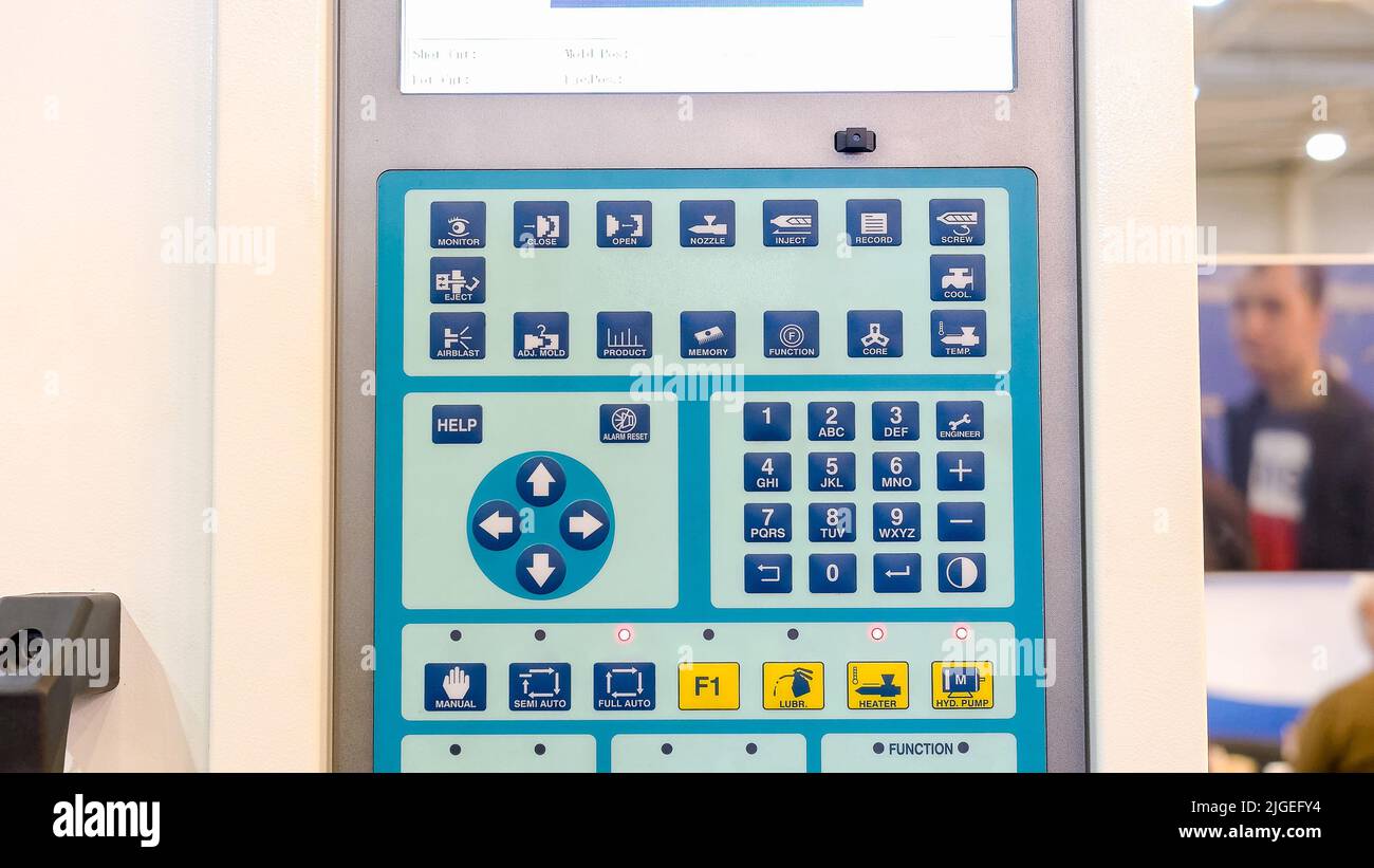 Close up control panel of injection molding machine. Blue machine ...