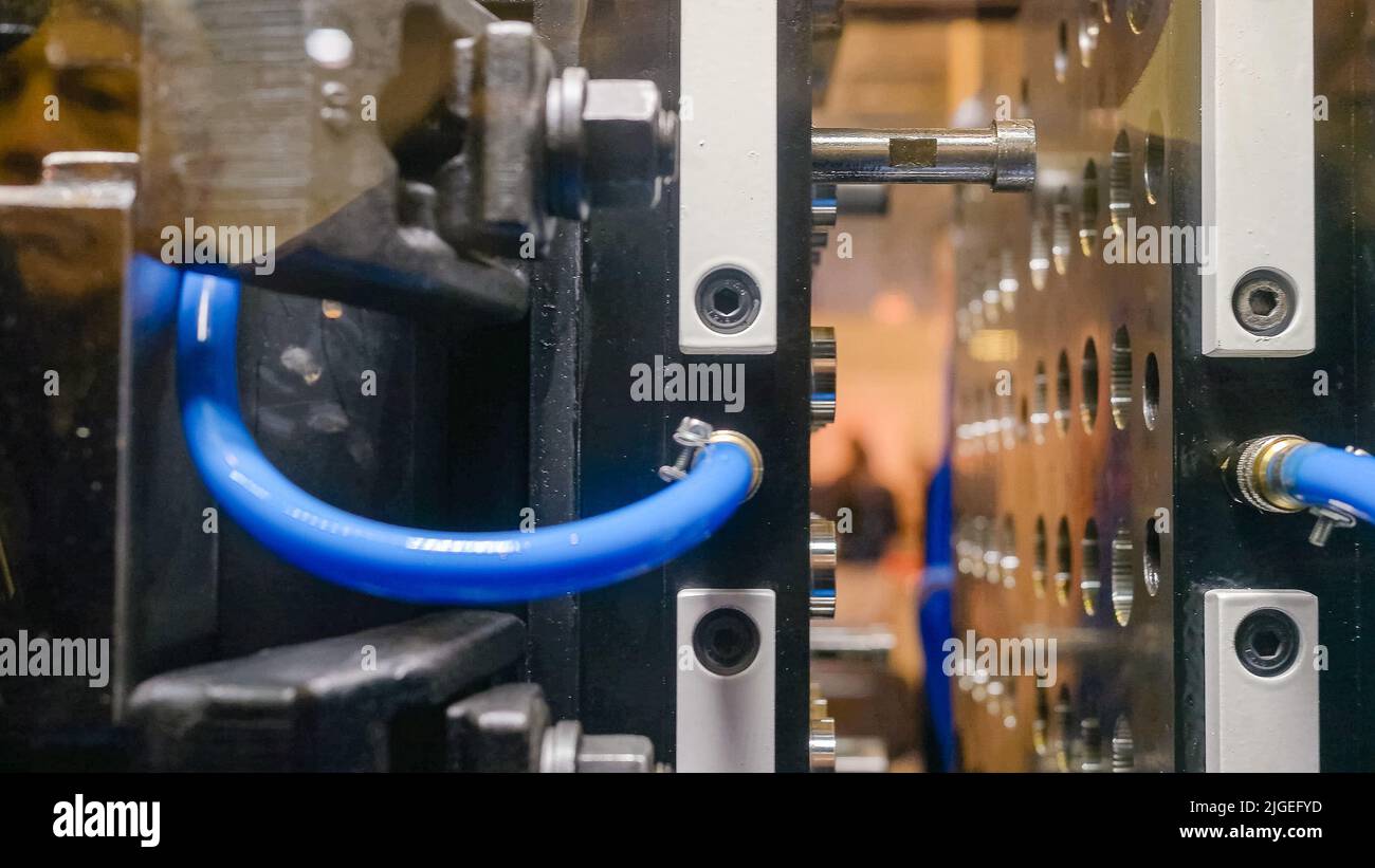 Injection molding machine moving back and forth. Black modern factory ...