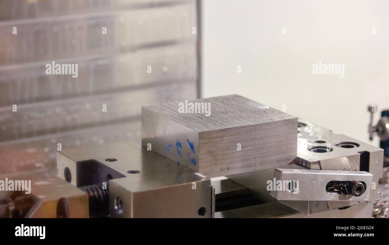 Dripping water drops on the metal block. Washing industrial machine ...