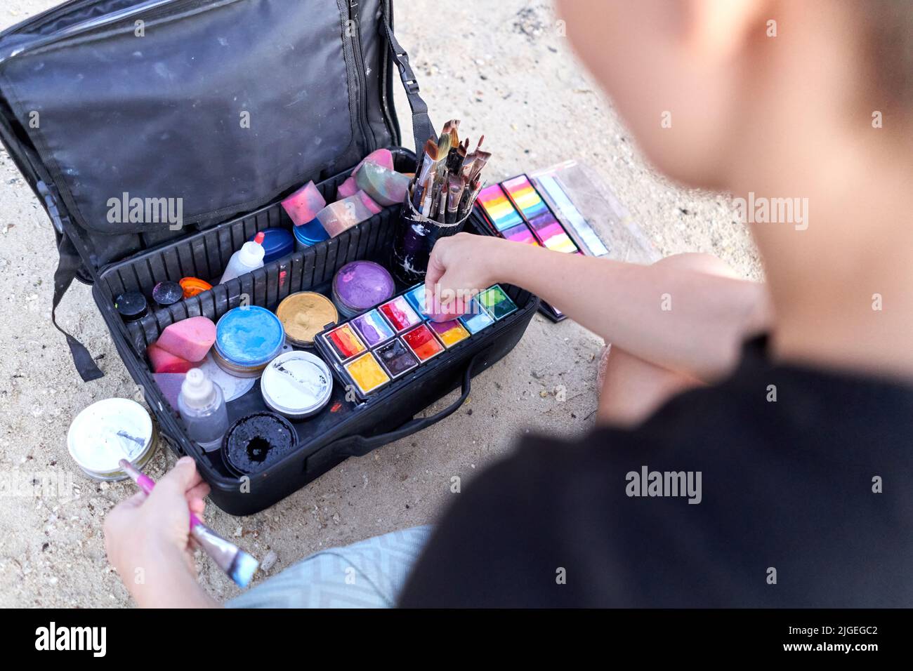 Top view of an artist using a box with paints Stock Photo - Alamy