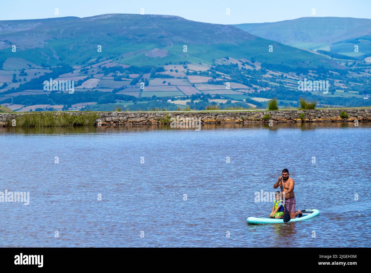 People enjoy the water at Keeper's Pond near Abergavenny in ...