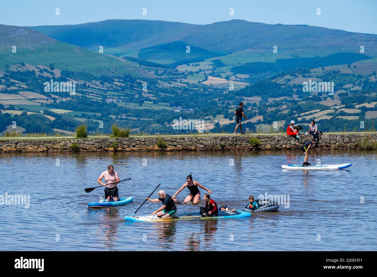 People enjoy the water at Keeper's Pond near Abergavenny in ...