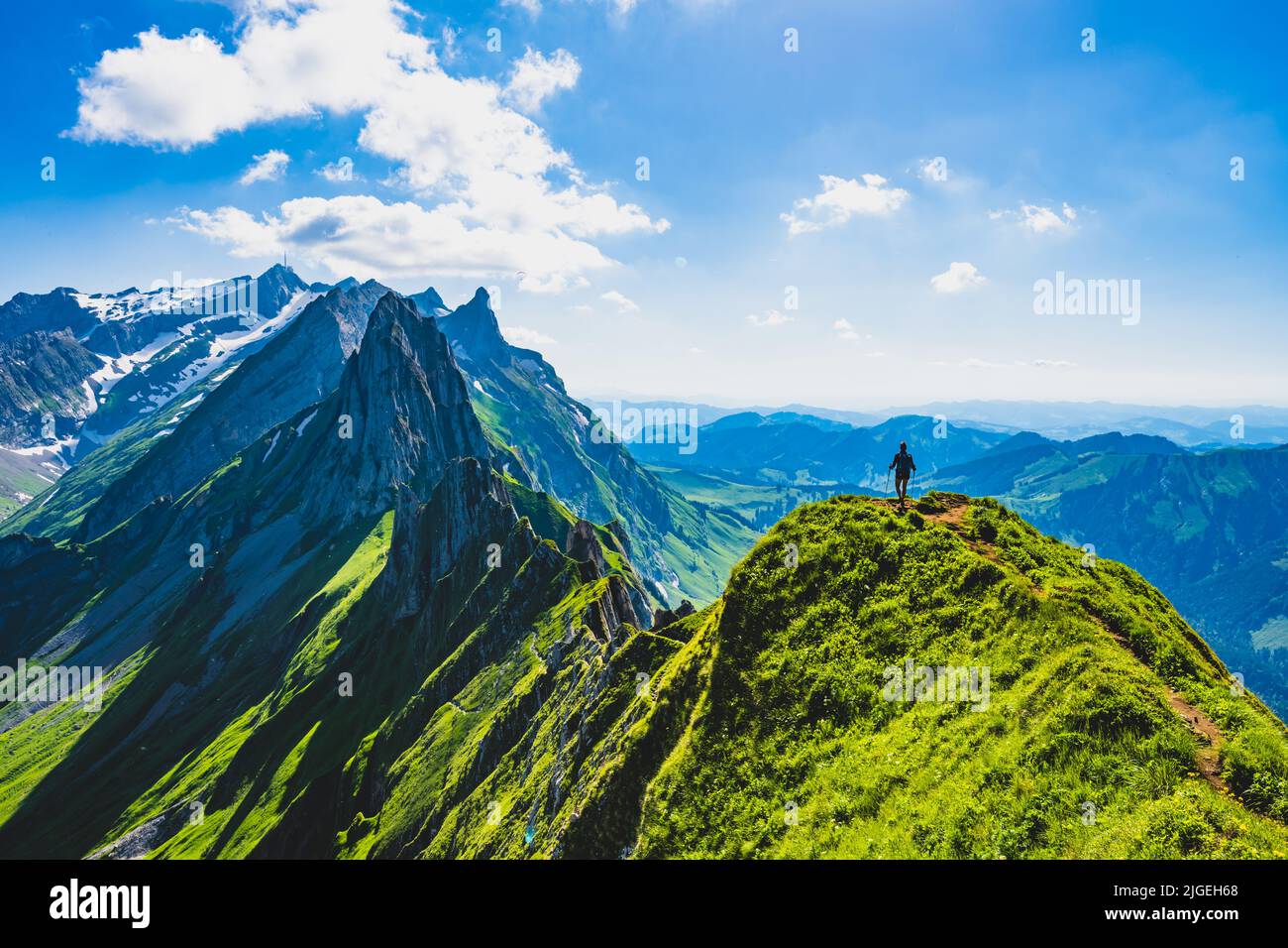 Woman is reaching a beautiful viewpoint along the Schäfler altitude ...