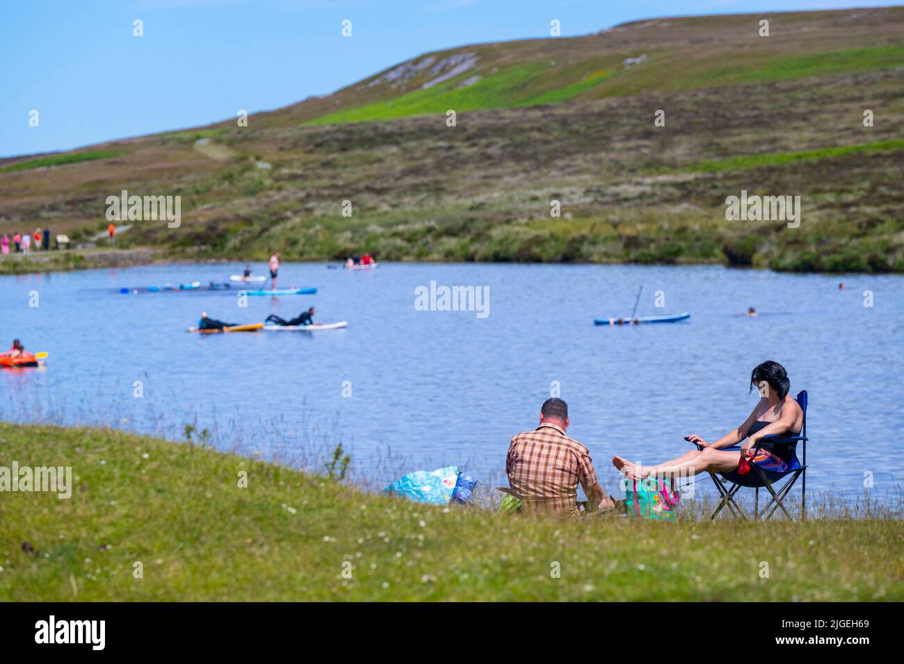 People enjoy the water at Keeper's Pond near Abergavenny in ...