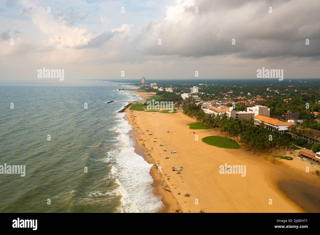 Seascape with tropical sandy beach and blue ocean. Negombo, Sri Lanka ...