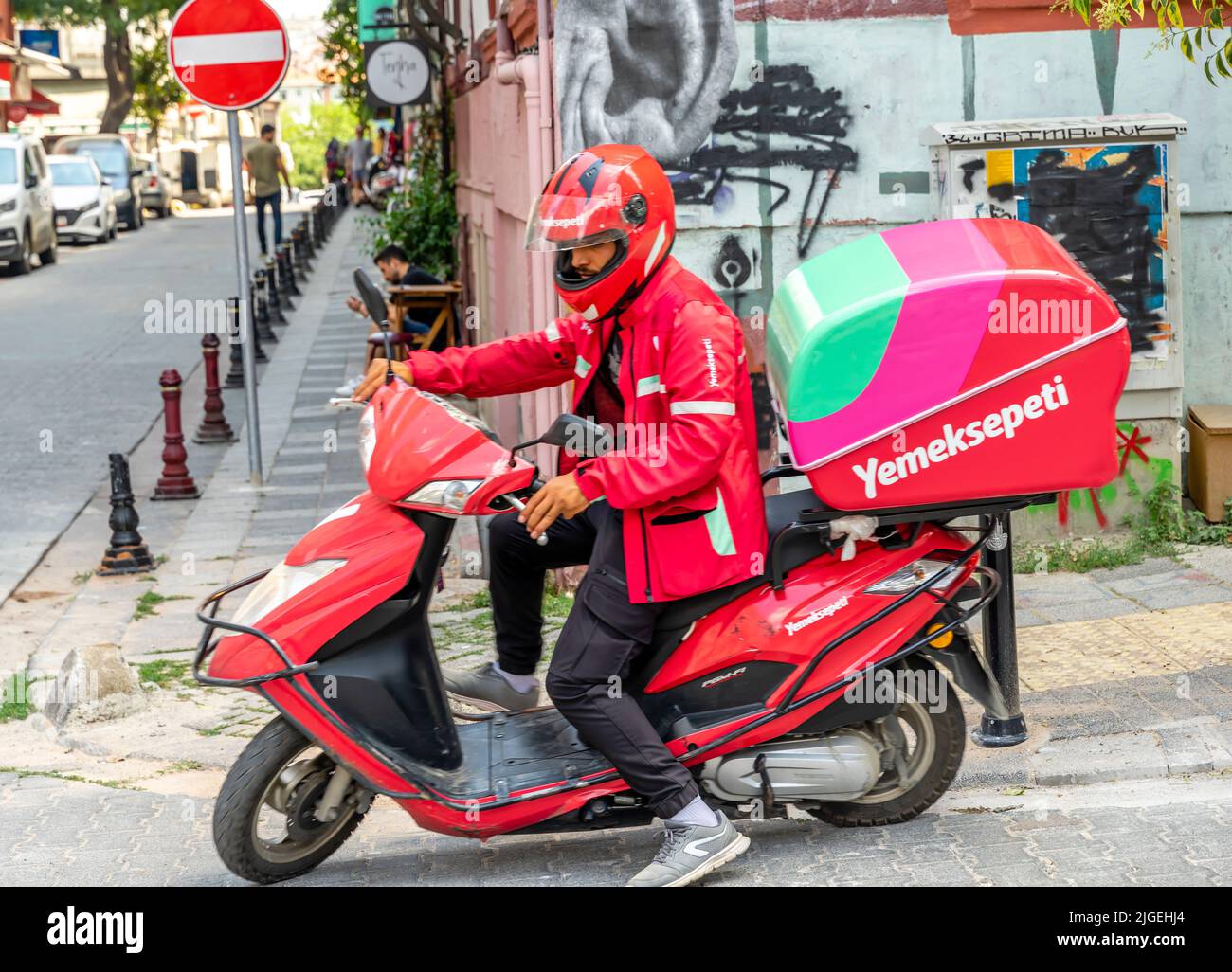 Yemeksepeti delivery guy on a bike. Delivery service in Istanbul ...