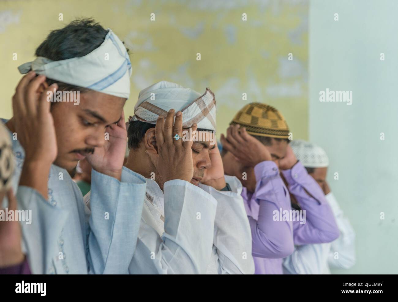 Nepalese Muslims perform the Eid al-Adha prayers at a Mosque. Muslims ...