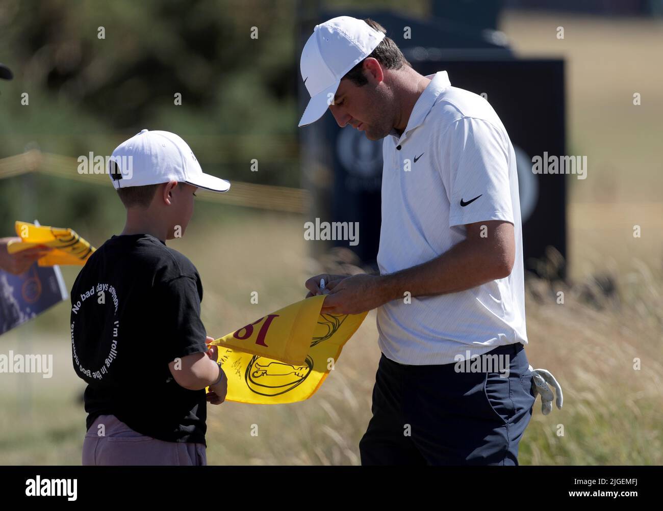 USA's Scottie Scheffler signs a autograph for a fan on Practice Day One ...