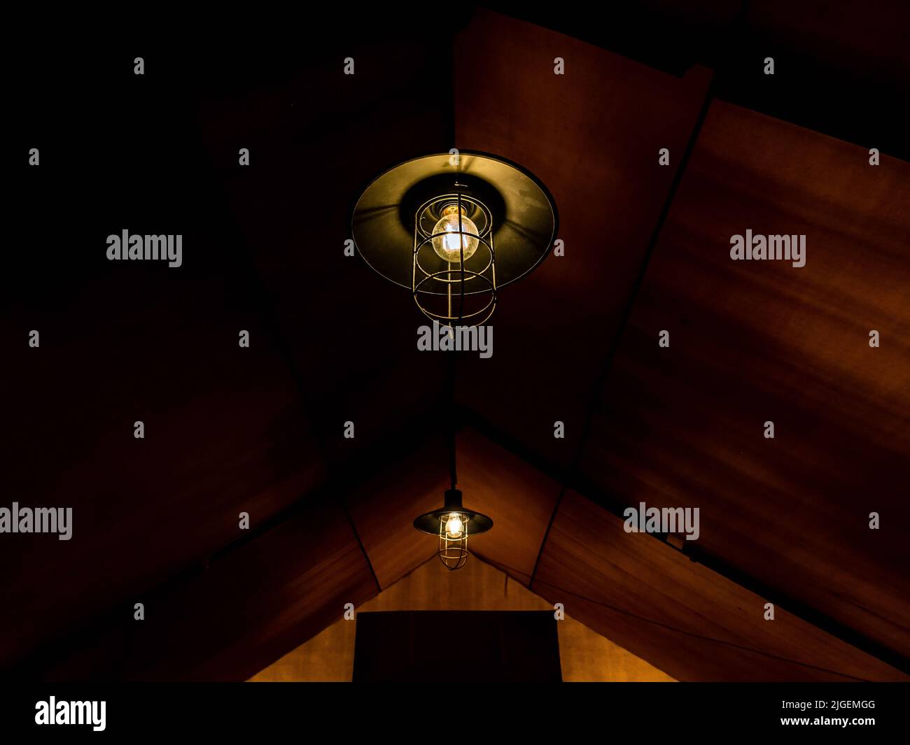 Old retro style lamp hanging on the ceiling inside the large glamping ...