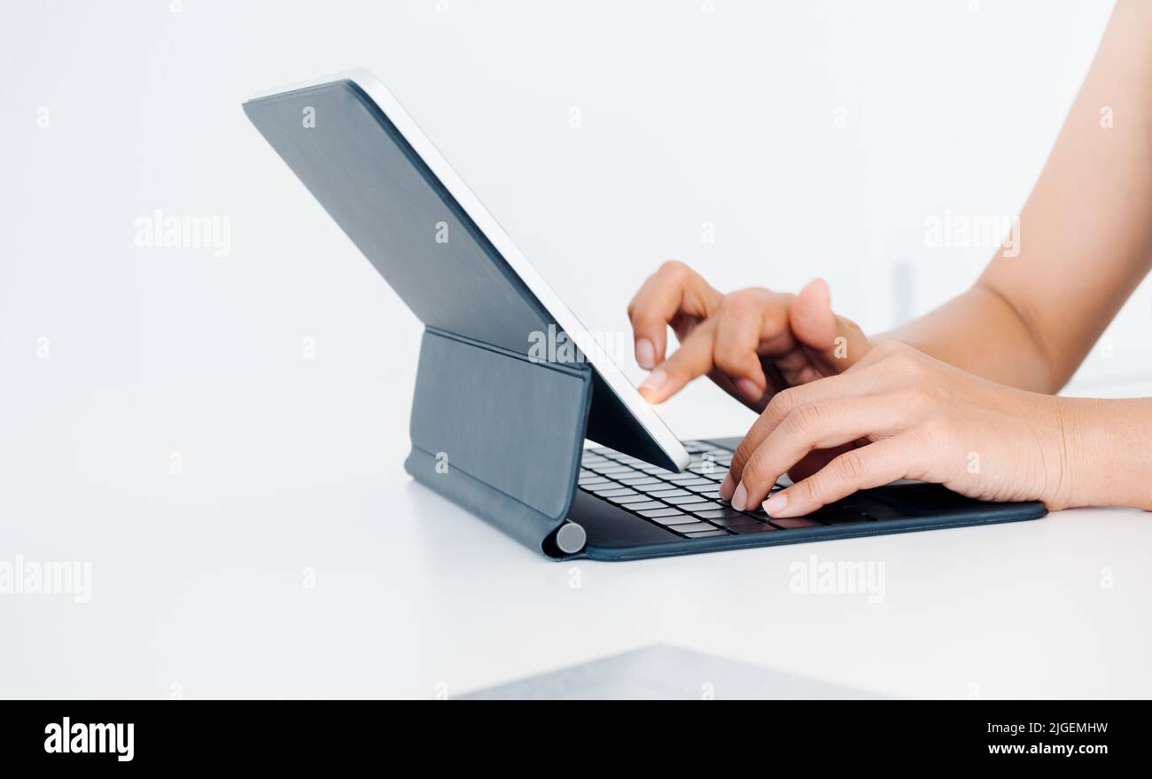 Finger touching and click on digital tablet screen while typing on ...