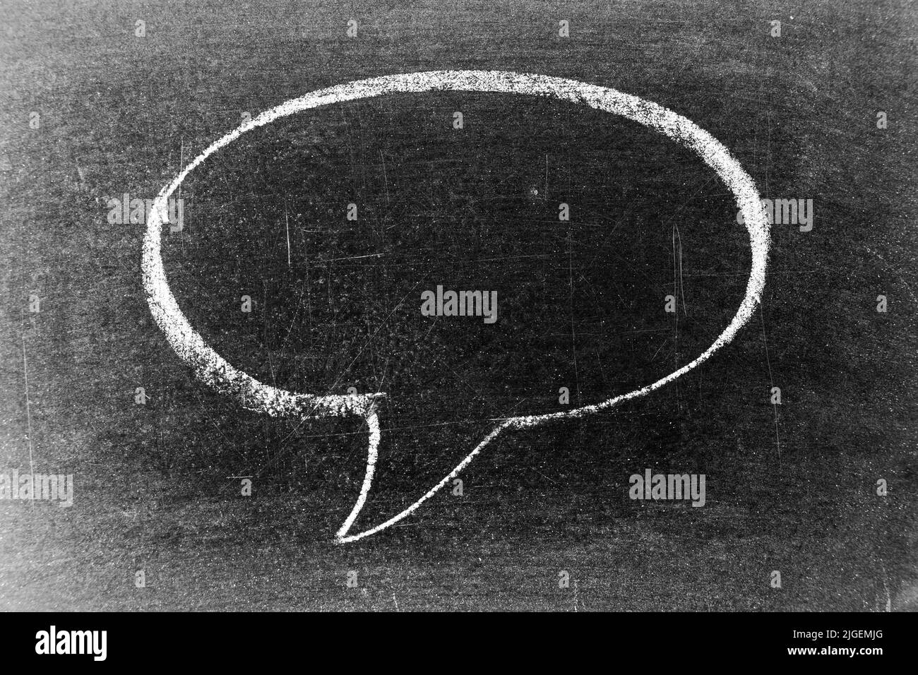 White color chalk hand drawing in round bubble speech shape with blank ...