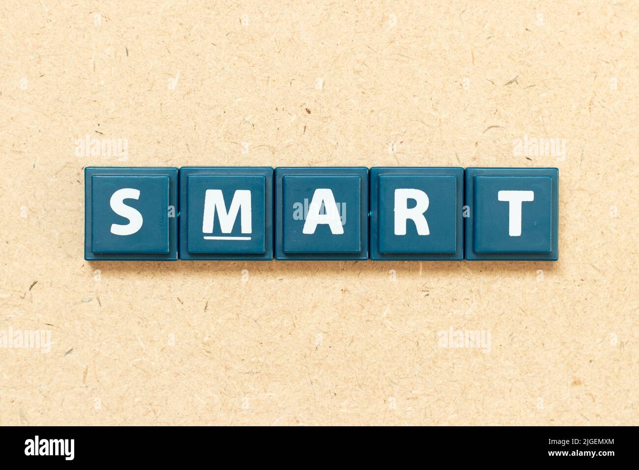 Tile alphabet letter in word smart on wood background Stock Photo - Alamy