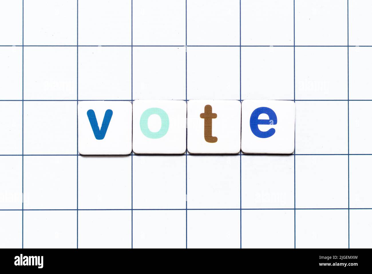 Colorful tile letter in word vote on white grid background Stock Photo ...