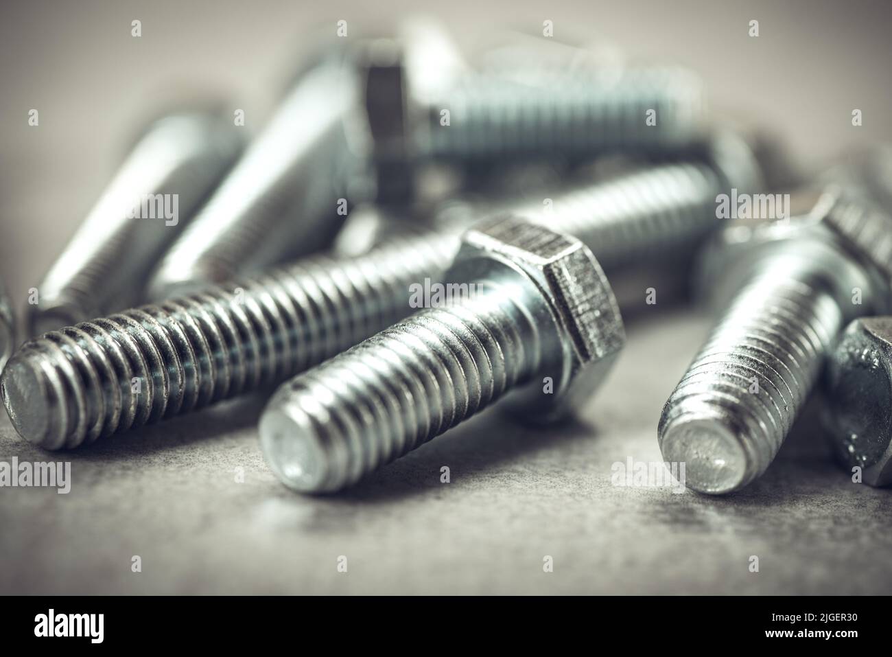 The metal bolts are covered. Chrome plated screw bolts Stock Photo - Alamy
