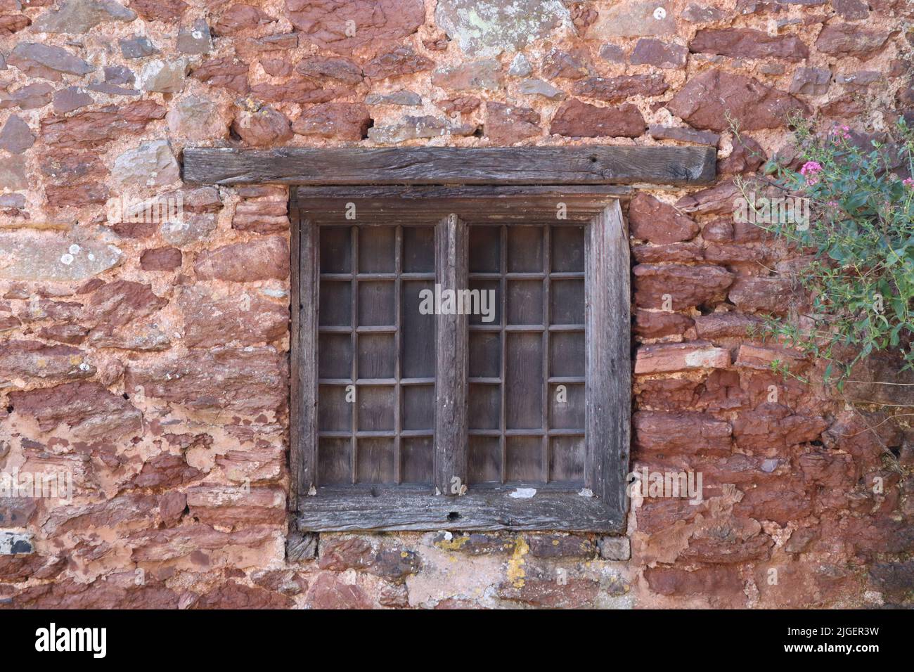 An old wooden framed window with leaded window panes in a house in ...