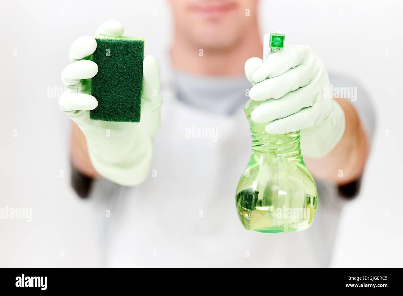 Up for the cleaning task. an unrecognisable man holding cleaning spray ...