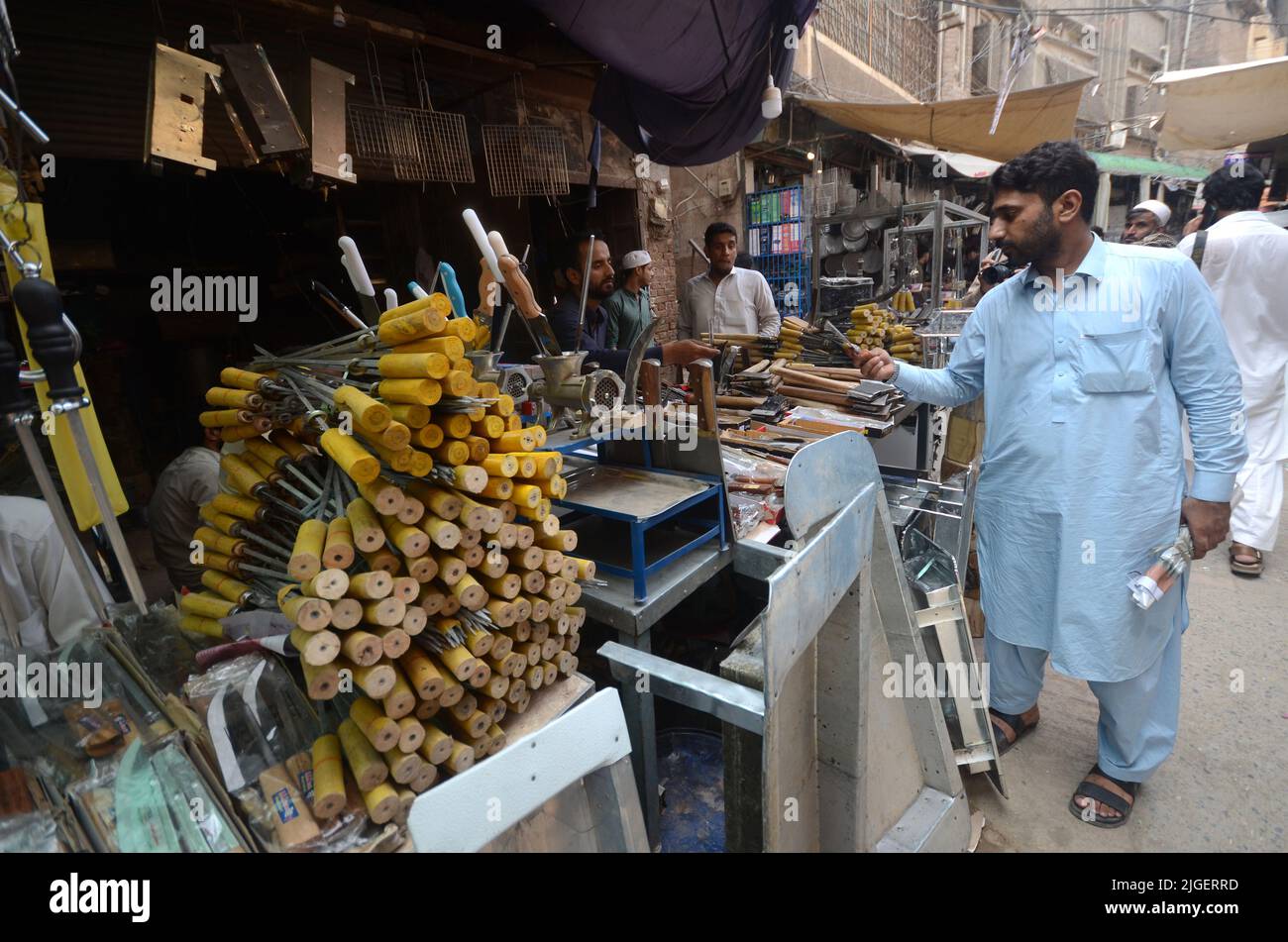 Peshawar, Pakistan. 08th July, 2022. (7/8/2022) A man sells stuff used ...