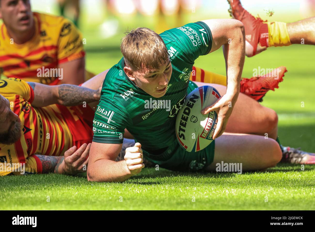 Matthew Nicholson #35 of Warrington Wolves goes over for a try on his ...