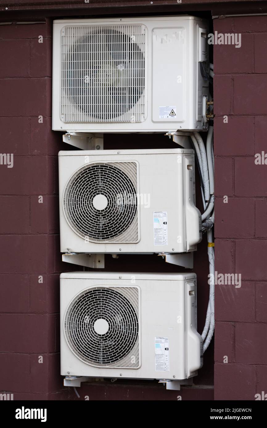 air conditioning unit Central split system hanging outside the building ...